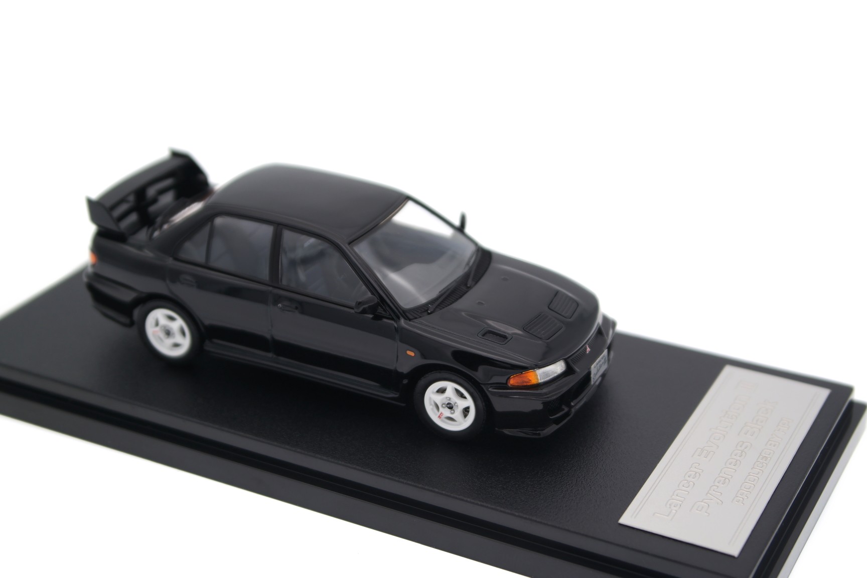 A collectible scale model Mitsubishi Lancer Evo III from HPI