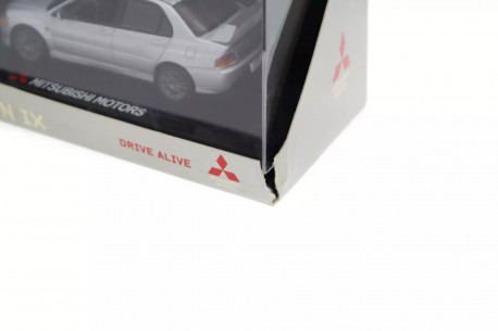 A collectible scale model Mitsubishi Lancer Evo IX from Vitesse